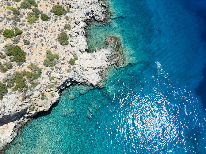 Swimmer and the coastline – Kate Richman Photography